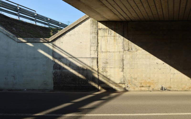 Grunge Concrete Wall of Underpass Divided in Two by the Sunlight. Two ...