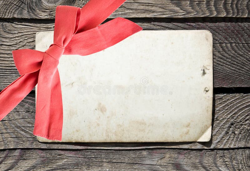 Grunge Empty Card and Red Bow on Wood Background Stock Photo - Image of ...