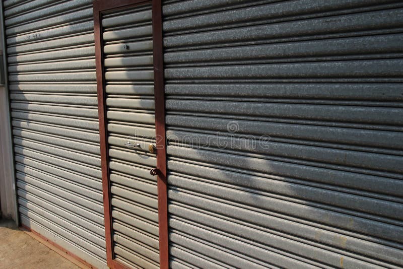 Grunge Roll Up Shutter Iron Gate Stock Image - Image of metallic ...