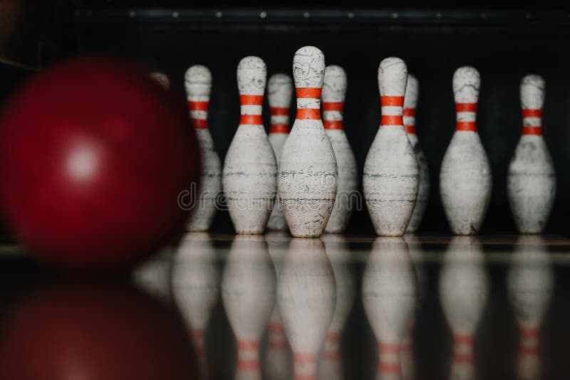 Grungy Bowling Pins with Red Ball on Foreground Stock Image - Image of ...