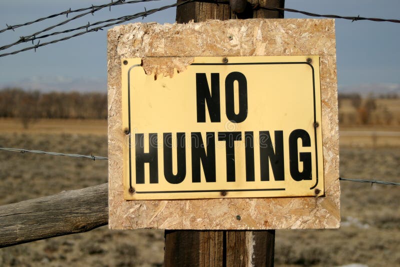 Grungy No Hunting Sign stock photo. Image of legal, wood - 493764