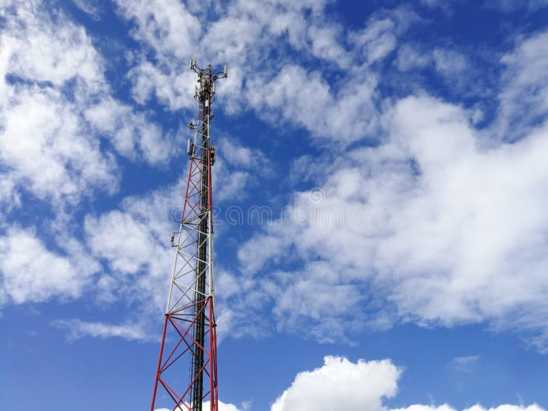 GSM Repeater Tower in Front of Blue Cloudy Sky Stock Image - Image of ...