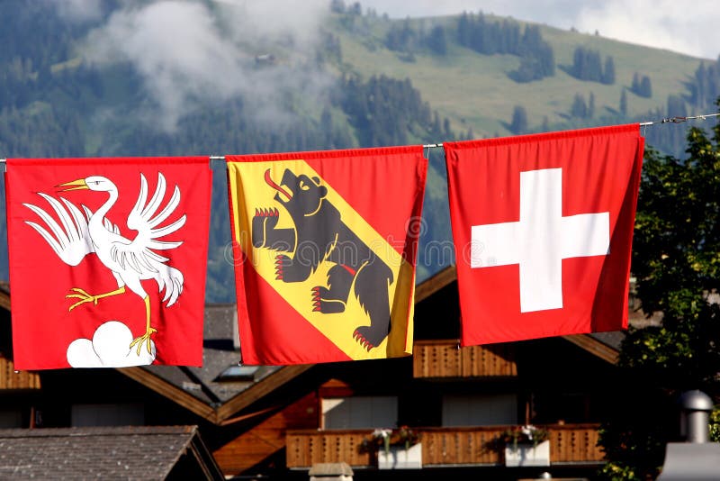Gstaad: Flags stock image. Image of yellow, chalet, switzerland - 27570719