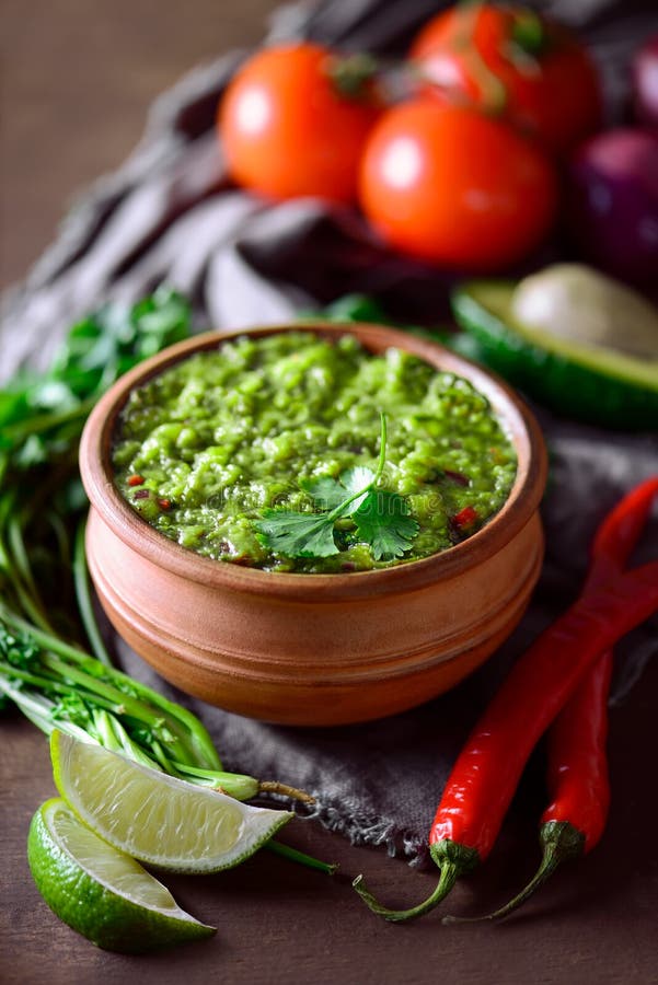 Guacamole in a rustic bowl stock image. Image of dinner - 85483397
