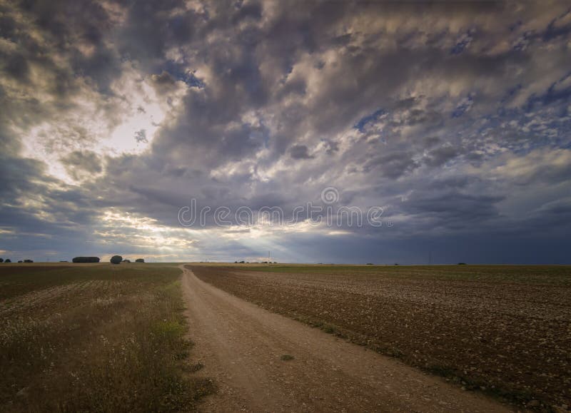 Cloudy Sky Over a Lon Rural Path Stock Photo - Image of bright, cloud ...