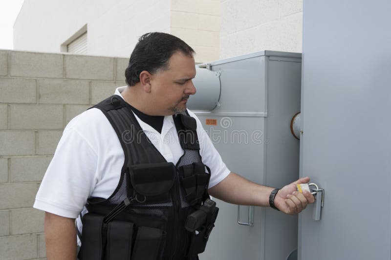Guard Checking Padlock stock photo. Image of lifestyle - 29659754