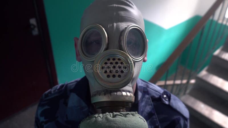Guard Dressed in Military Uniform in a Gas Mask Looking in the Camera ...