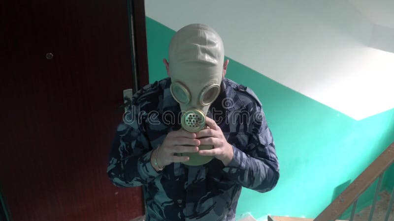 The Guard, Dressed in Military Uniform Wearing a Gas Mask Stock Footage ...