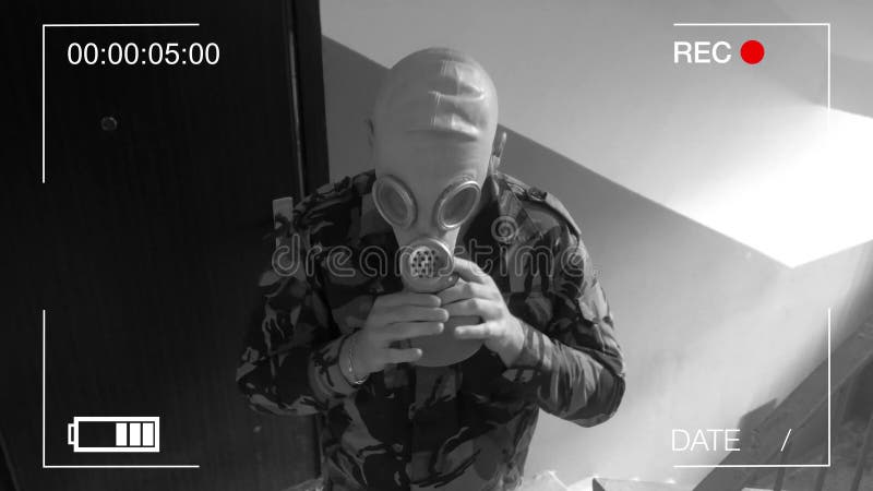 Military Man with Gas Mask and Camera Photographs the Destruction of ...