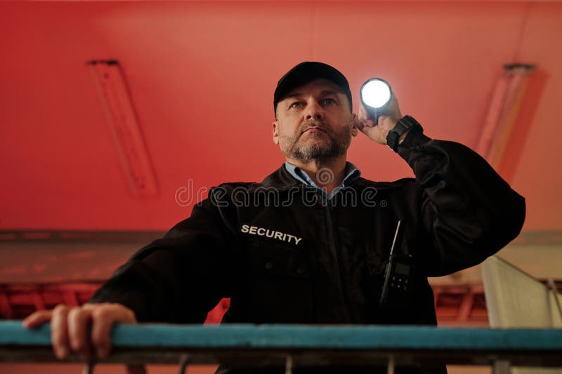 Guard Lighting Forward with Flashlight Stock Image - Image of caucasian ...