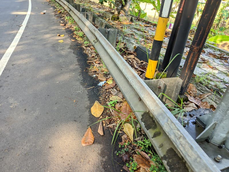 Guardrail or Road Safety Fence Located at the Edge of the Asphalt Road ...