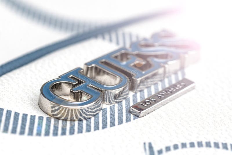 Guess - Close-up of Fashion Logo in Bright Light Editorial Image ...