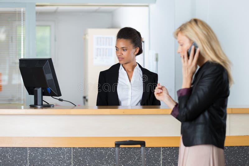 Guest at front desk stock image. Image of professional - 101668949