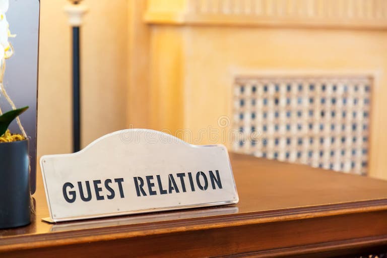 Guest Relation Sign on the Table in the Hotel Stock Photo - Image of ...