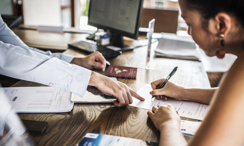 Guests Checking in To a Hotel Stock Photo - Image of happy, handing ...