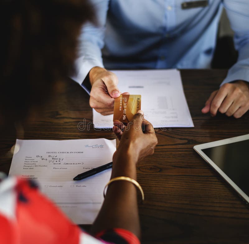 Guests Checking in To a Hotel Reservation Counter Stock Photo - Image ...