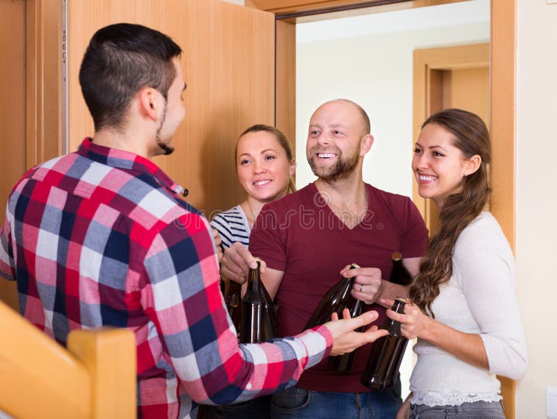 Guests standing in doorway stock photo. Image of family - 54054326