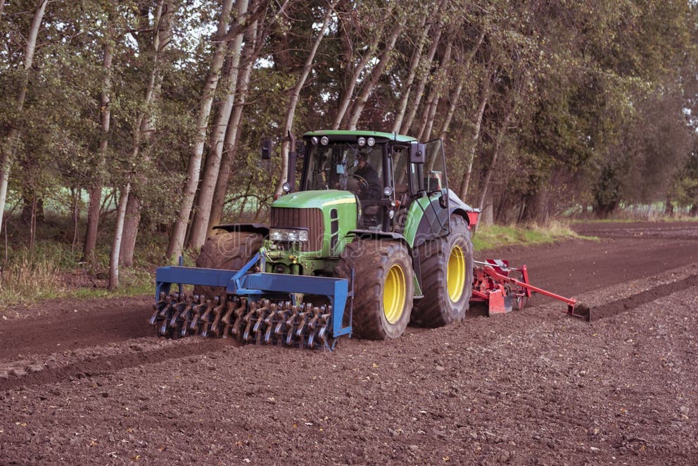 Tractor with Seed Drill and Front Packer Which Compacts the Soil ...
