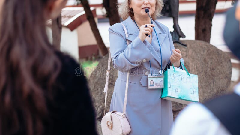 Guide and a Group of Tourists Standing on the Steps of the Hotel. Stock ...