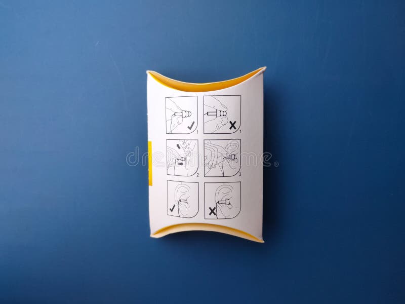 A Guide on How To Use Ear Plugs Correctly is Displayed on the Back of ...