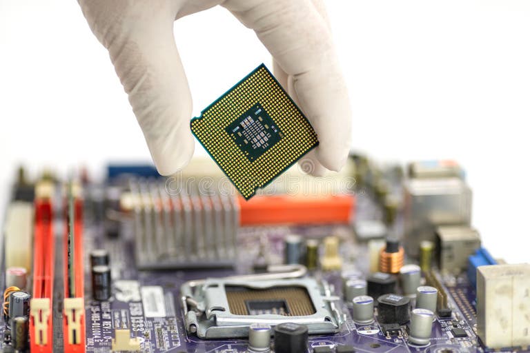 Gloved Hand Holds Cpu Over Computer Motherboard Stock Photos - Free ...