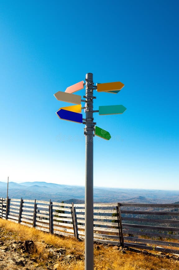 Guidepost with Arrows Against Blue Sky Stock Image - Image of journey ...