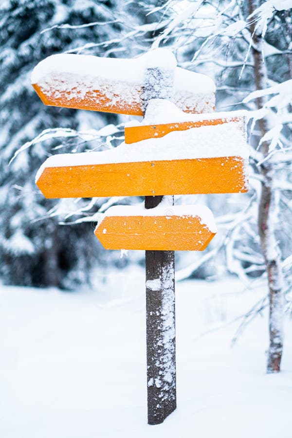 Guiding Sign Covered with Snow Pointing in Different Directions Stock ...