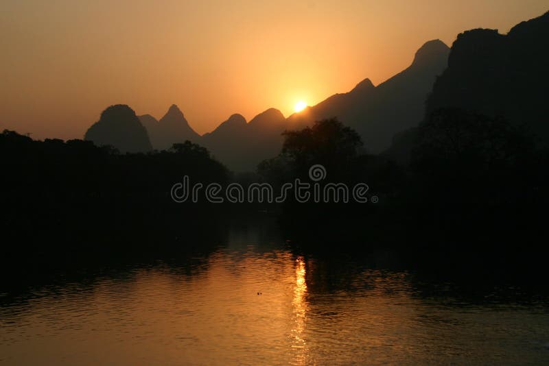 Sunset on Chinese lake stock image. Image of still, quiet - 443947