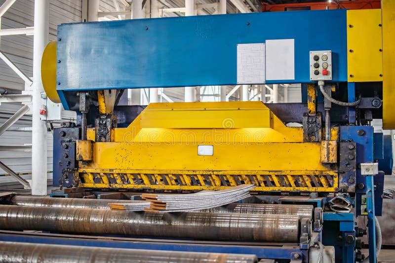 Guillotine Machine Cutting Metal Sheets in an Industrial Workshop ...