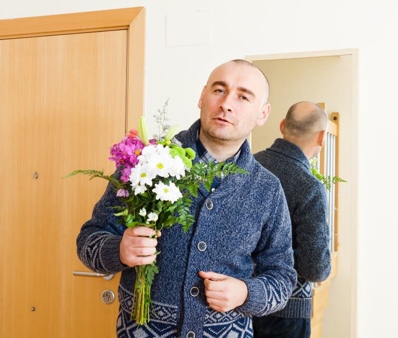 Guilty man with bouquet stock photo. Image of adult, people - 39997932