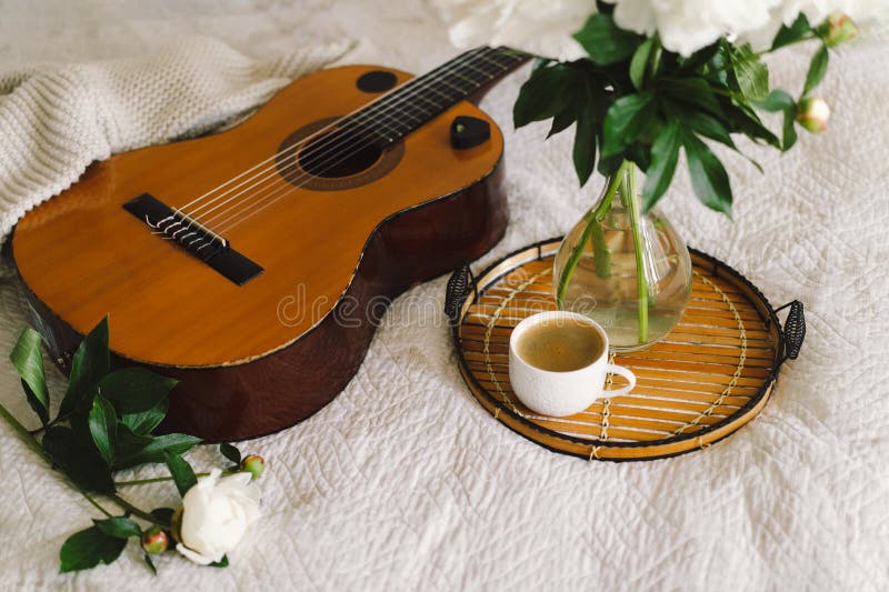 Guitar on Bed with Spring Flowers and Coffee. Stock Image - Image of ...