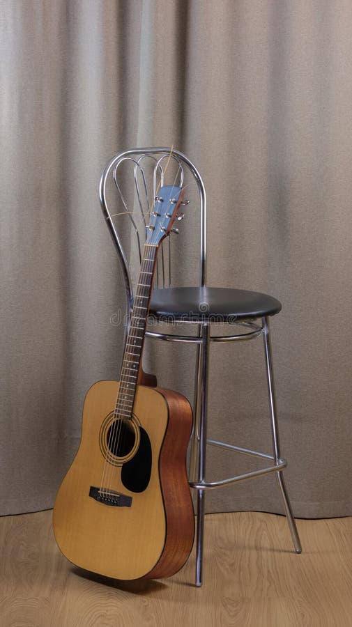 Guitar and Chair stock photo. Image of play, fretboard - 235641998