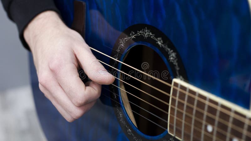 Guitar Class Plucking the Strings Stock Image - Image of blue, hole ...
