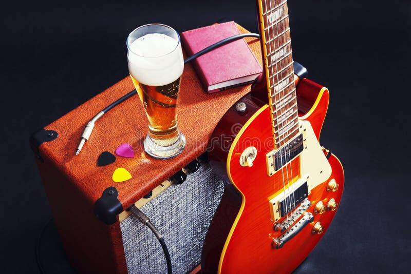 Guitar Combo Amplifier with Black Electric Guitar, Glass of Beer and ...