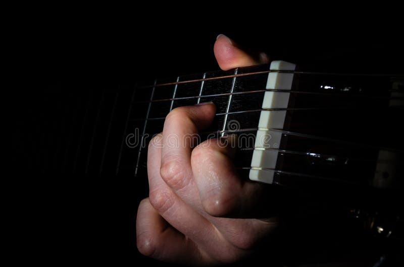 Guitar fingers low key stock photo. Image of male, background - 146581302