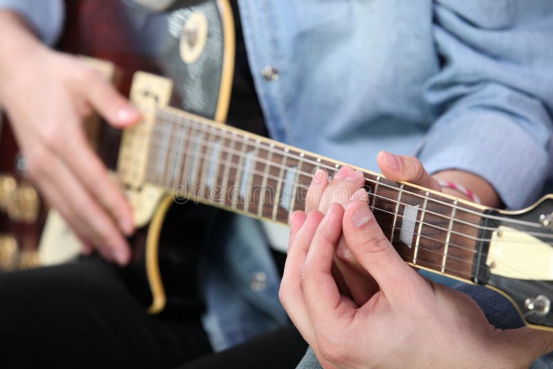 Guitar lesson stock image. Image of learning, musician - 26795675