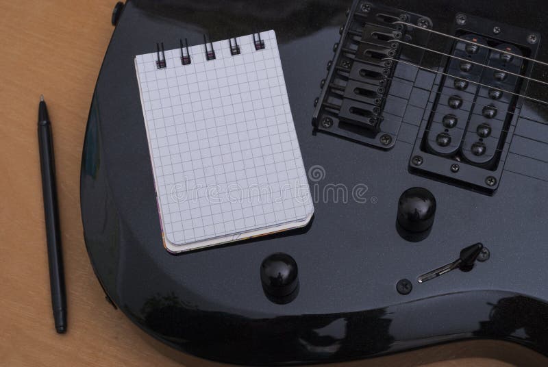 Guitar and notebook stock image. Image of spiral, guitar - 65083301