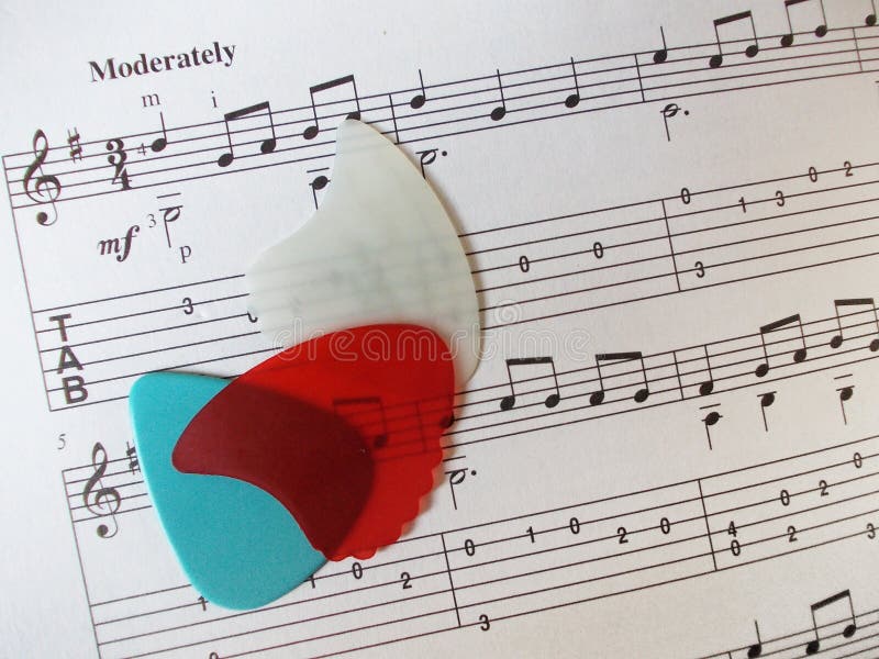 Guitar Picks and Music Sheet Stock Photo - Image of plectrum, notes ...