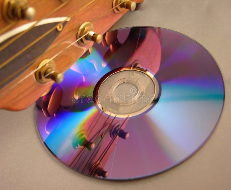 Guitar reflection in CD stock image. Image of technology - 586543