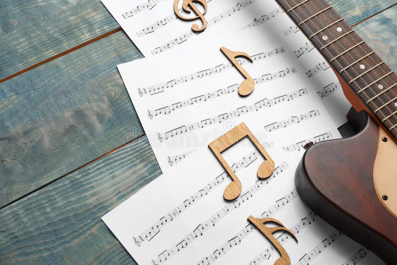 Guitar and Sheets with Music Notes on Table. Space for Text Stock Photo ...