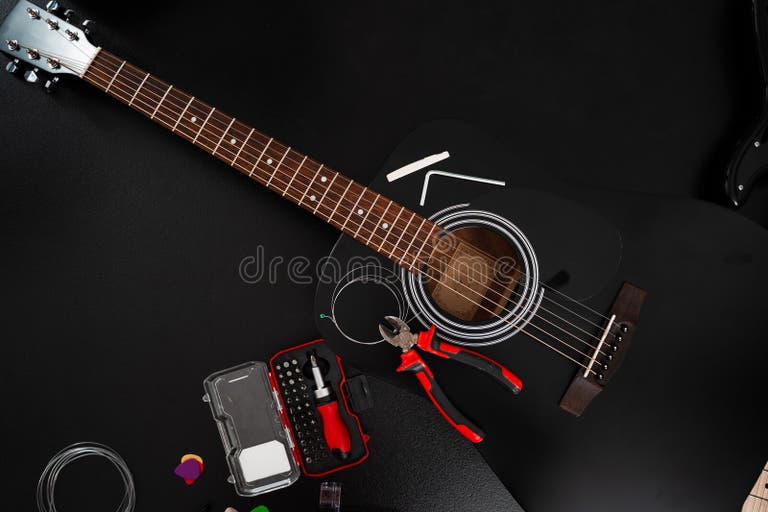 Guitar String Replacement with Tools. Acoustic Guitar Setup in Progress ...