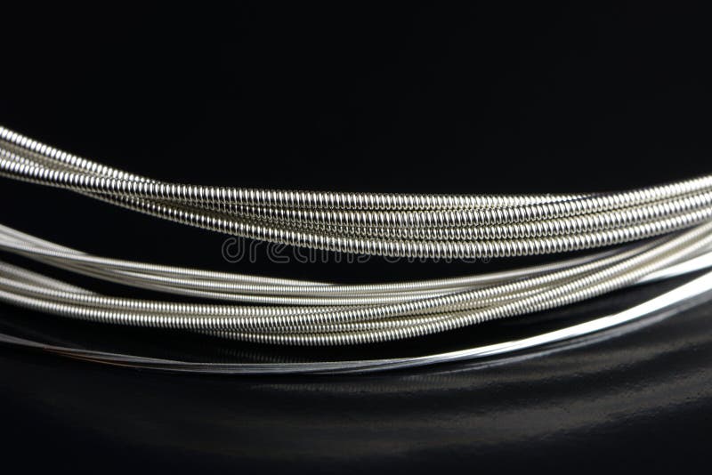 Guitar Strings Close-Up on Glossy Black Background Stock Photo - Image ...