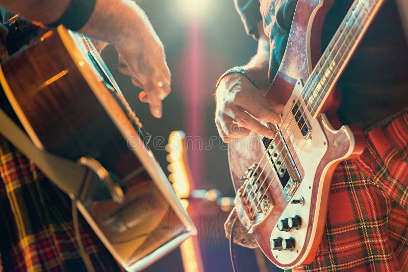 Guitarist and Bassist Pop Musicians during a Group Performance Stock ...