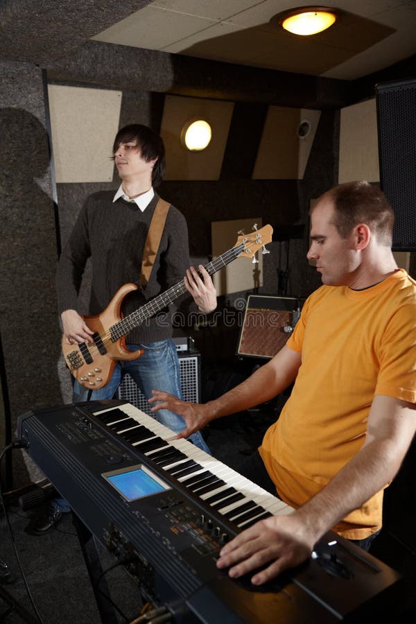 Guitarist and Keyboard Player is Working in Studio Stock Image - Image ...