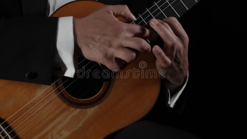 Male Guitarist Plays the Classical Acoustic Guitar, Learning Chords ...