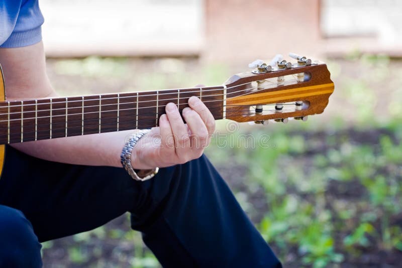 The Guitarist`s Hand Holds the Guitar Stock Photo - Image of expression ...