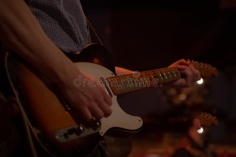 Guitarists Playing Electric Guitars on Stage Stock Photo - Image of ...