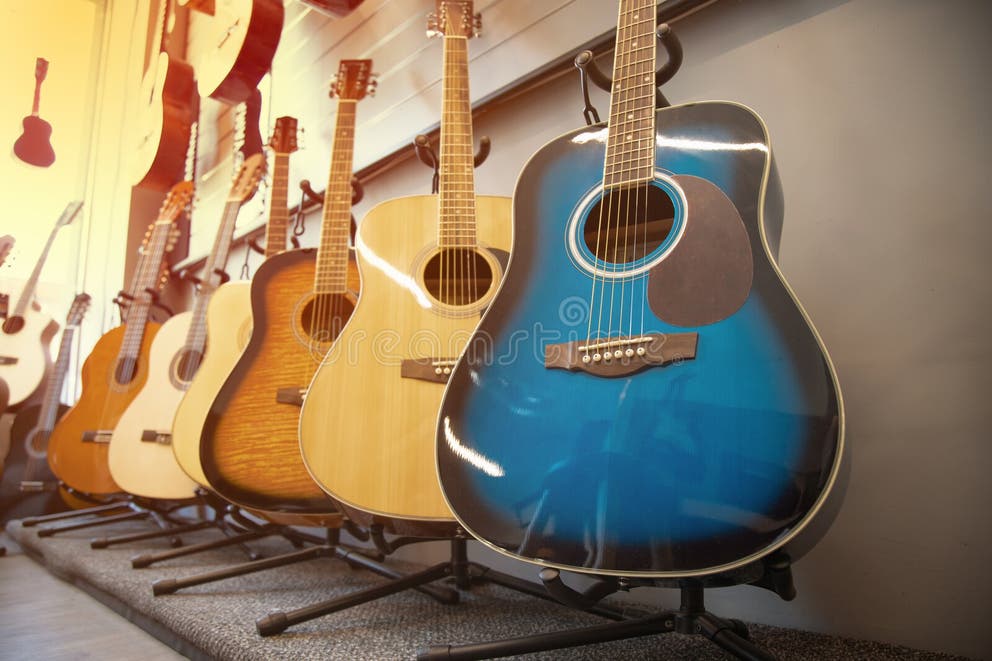 Guitars on Sale. Stack of Musical Instruments Editorial Stock Photo ...