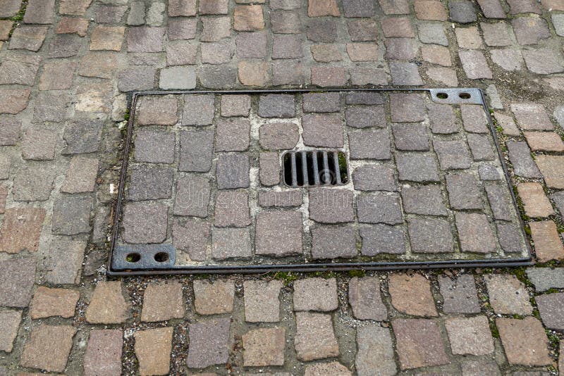 Gully Cover, Which is Embedded in the Floor with Bricks and Therefore ...