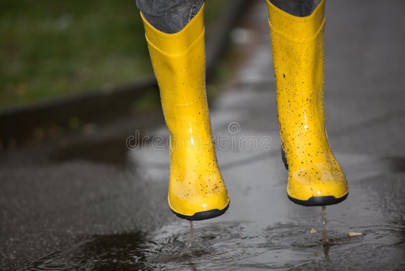 Gumboots and a puddle stock photo. Image of playful, natural - 26037914